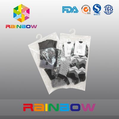 China Milk White Clear Plastic Pouches Packaging Hanging Hook Bag With Zipper For Socks for sale