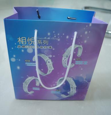 China Flat Bottom Printed Custom Kraft Paper Shopping Bags With Drawstring for sale