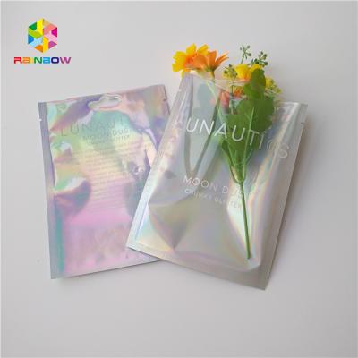 China Three Side Sealed Cosmetic Packaging Bag Laster Film Material Glossy Varnish Surface for sale