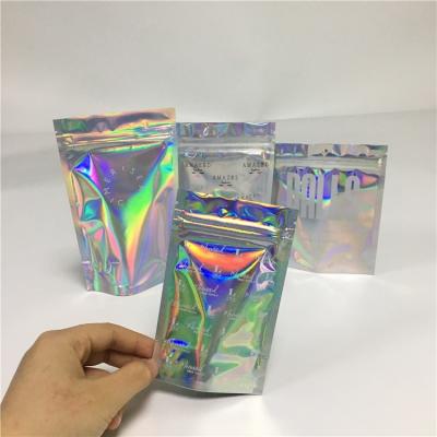 China Durable Hologram Stand Up Pouches Mylar Weeds Smell Proof Bags With Clear Window for sale
