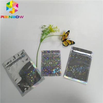 China Glitter Flash Star Hologram Mylar k Bags Glossy Three Side Seal Facial Mask Packing for sale