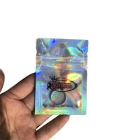 China Glossy Foil Plastic Pouches Packaging Custom Hologrphic  For Candy Food for sale