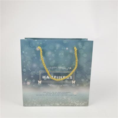 China Best Selling Recyclable Environmental Friendly Logo Printed Shopping Paper Bag Packaging White 110 Gram Reusable for sale