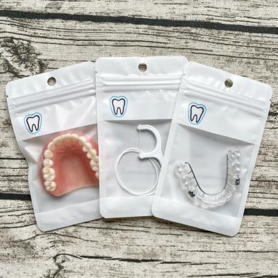 China Custom Flat Zip Lock Mylar Bags One Side Transparent Zipper Retainers For False Tooth Clear Aligner Packaging Bag for sale