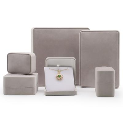 China Sleek Rounded Edge Velvet Jewelry Case Various Color Packaging Jewelry Box Set for sale
