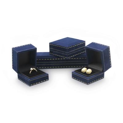 China Navy Blue Paper Texture Luxury Jewelry Case Set Luxury Engagement Ring Box for sale