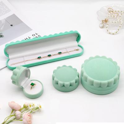 China Simple Round Plastic Velvet Luxury Jewelry Box Set Large Double Ring And Earring Box Stylish for sale