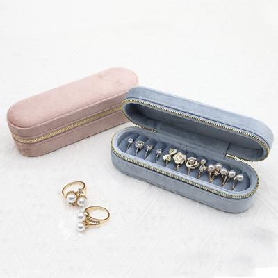 China Portable Oval Velvet Ring Box Ring Storage Case Velvet Travel Jewelry Box Customization for sale