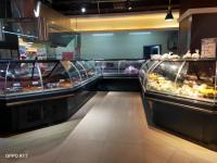 China Wheels with Refrigerated Deli Display Case Stainless Steel Body Material Offering Temperature Control and Easy Product Access for sale