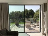 China Customized Size Patio Sliding Doors Double Glazed 5mm+12A+5mm Aluminum Frame for sale