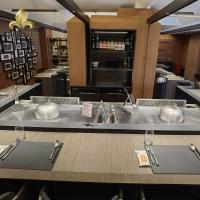 China Restaurant Heavy Duty 8KW Power 11 Seats Food Grade Special Alloy Steel Teppanyaki Grill Table for sale