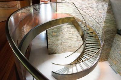 China Modern Curved Steel Spiral Staircase Polished Finish for Residential Use 1200mm Diameter for sale