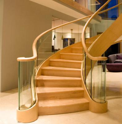 China Wood Grain Coated Modern Curved Staircase Easy Install With Glass Railing for sale