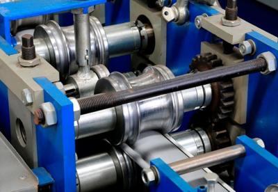 China Hydraulic Cutting Steel Roller Shutter Roll Forming Machine Door Latch Roll Former for sale