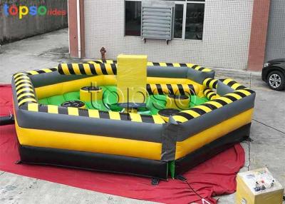 China Safe Portable Amusement Rides Wipeout Jumping Castle Positive Participation for sale