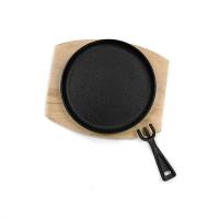 China Matt Black Oval Pre Seasoned Cast Iron Steak Plate 27.5x17.5x2cm with Wooden Base for sale