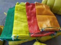China Red PP Leno Woven Mesh Bag with Drawstring 1.4mm x 1.6mm Mesh 5kg-25kg Capacity for sale