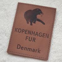 China Customizable Embossed Leather Patches using eco friendly top grain leather with blind embossing and color filled embossing techniques for finish for sale