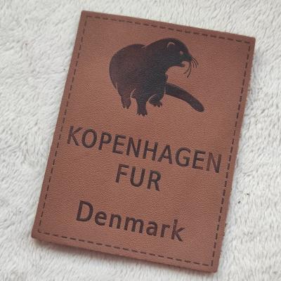 China Customizable Embossed Leather Patches using eco friendly top grain leather with blind embossing and color filled embossing techniques for finish for sale