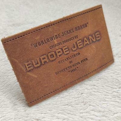 China Wholesale Custom Real Leather Patches Brand Logo PU Leather Debossed Logo for Garment for sale