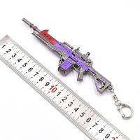 China Purple mini metal gun mold Key ring 1:6 authentic restoration of game props gun Ape x shoot game gun keychain for sale