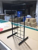 China Customizable Black Metal Peg Display Stand Floor Standing Display Rack With Feet for sale