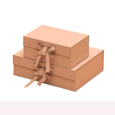 China Luxury Magnetic Packaging Box Book Shaped Paper Clamshell Gift Box Custom Print for sale