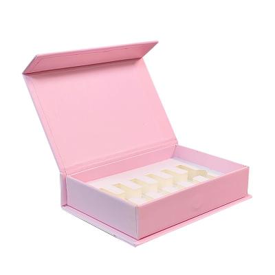 China Custom Pink Perfume Essential Oil Bottle Foam Magnetic Paper Boxes with Matt Lamination for sale