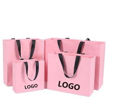 China Exquisite Hand Length Handle Sealing Cardboard Luxury Multicolor Printing Bags for sale