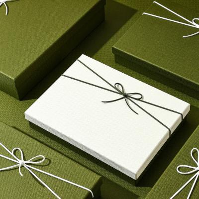 China Custom Luxury Cardboard Lid And Base Cosmetic Packaging Box Personalized Gift Box Set With Ribbon for sale