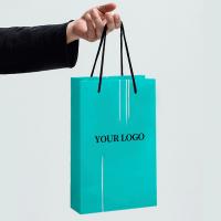 China Customized High-end Hand held Gift Bags Clothing Store Personalized Craft Kraft Paper Bags Gift Packaging for sale
