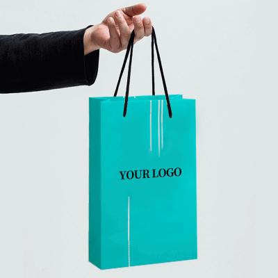 China Customized High-end Hand held Gift Bags Clothing Store Personalized Craft Kraft Paper Bags Gift Packaging for sale