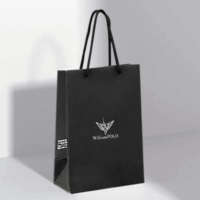 China Custom White Black Paper Plain Paper Bags For Dresses Shopping With Your Own Logo Printed for sale