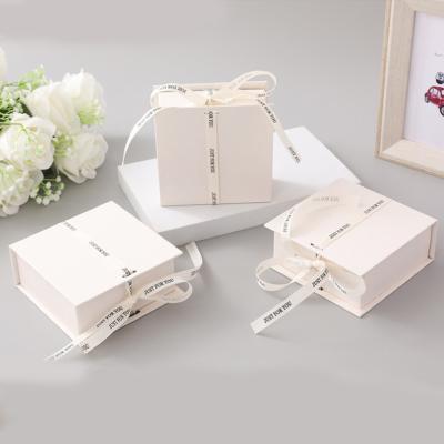 China White Ribbon Logo Foldable Gift Box Make Up Clothes Accessories Rigid Paperboard With Glossy Lamination for sale