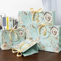 China Custom Eco Paper Shopping Packaging Gift Bag Printed With Your Own Logo for sale