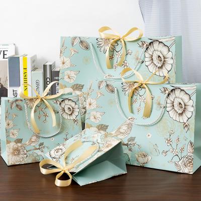 China Custom Eco Paper Shopping Packaging Gift Bag Printed With Your Own Logo for sale