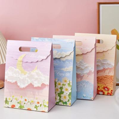 China Customized Kraft Art Gift Paper Packaging Bag Personalized Pink Small Packaging Hand Held for sale