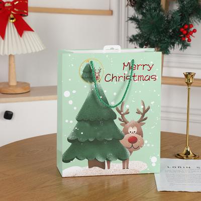 China Eco Friendly Green Recycled Christmas Paper Bags Sustainable Holiday Gift Packaging Solutions for sale
