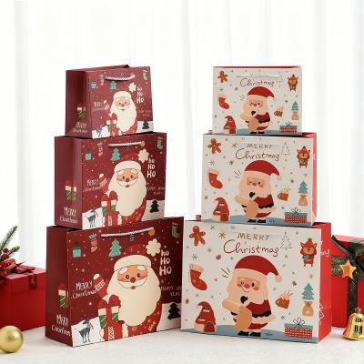 China Custom Sizes Printed Kraft Christmas Bags Luxury Gift Bags with Ribbon Handle for sale