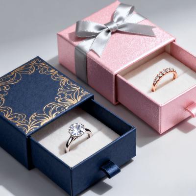 China Vintage Luxury Custom Logo Ring Boxes Ivory Board with Sponge Velvet Lining Stamping Varnishing UV Coating Printing Handling for sale