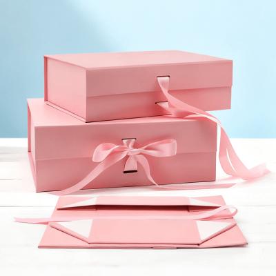 China Custom Logo Quality Ribbon Folding Box Pink Black Rectangle Shape Magnetic Art Paper Packaging for Matt Lamination Embossing for sale