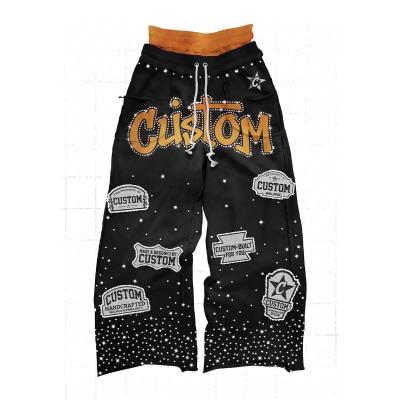 China Heavyweight 380-450 GSM Men Sweatpants with Custom Raw Edge Applique and All-Over Rhinestone Detailing for sale