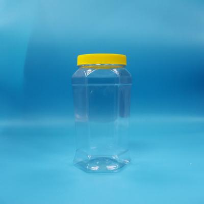 China Food Grade Hexagonal Clear PET Candy Jar 1120ml with Yellow Screw Cap for sale