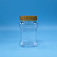 China 450ml 70mm Food Grade PET Candy Jar Airtight Clear Plastic with Brown Flat Lid for sale