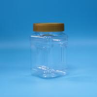 China 450ml 70mm Food Grade PET Candy Jar Airtight Clear Plastic with Brown Flat Lid for sale