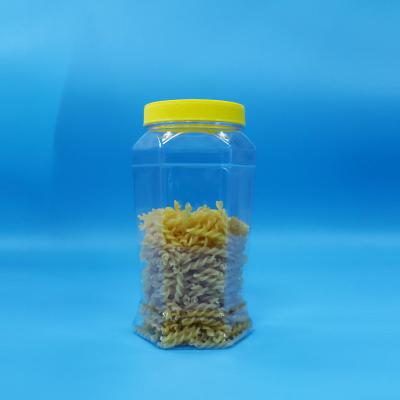 China Hexagonal Clear PET Candy Jar 1120ml Food Grade with Yellow Flat Cap 85mm Neck for sale