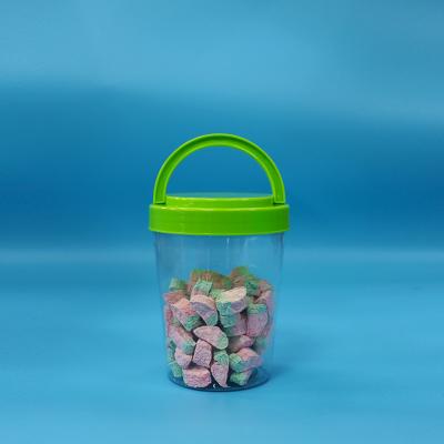 China Transparent PET Plastic Food Jar 820ml 85mm Diameter with Green Handle Cap for Candy Storage for sale