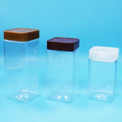 China Food Grade PET Transparent Square Plastic Jar 395ml 555ml Screw Lid for Candy Snacks Nuts for sale