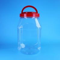 China Large 2100ml Capacity Food Grade PET Plastic Candy Jar with Red Handle Lids for sale