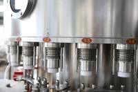 China 3-in-1 Automatic Carbonated Beverage Rotary Filling Machine - 18 Heads, 3200 BPH Capacity for Glass Bottles for sale